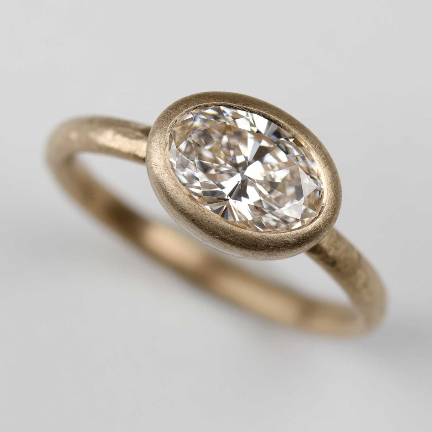 East West Bezel-set Engagement Ring with Rugged Texture Band – Aide-mémoire